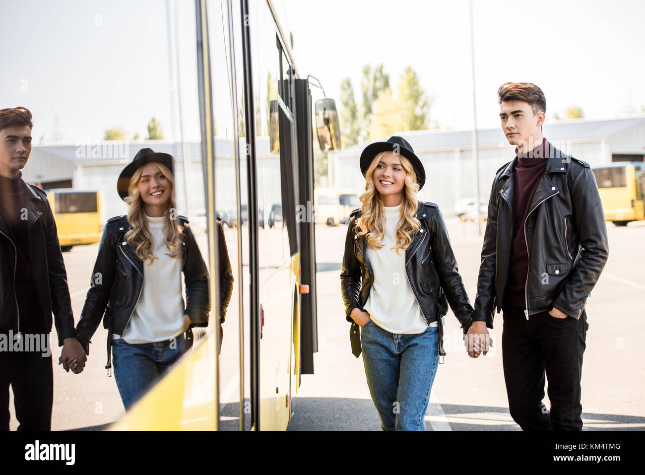 couple entering bus Stock Photo - Alamy