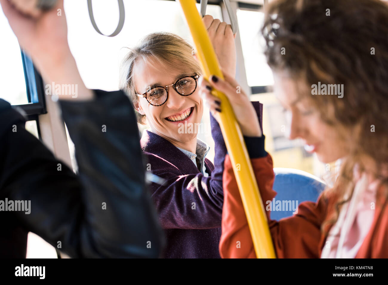 happy young man in bus Stock Photo - Alamy