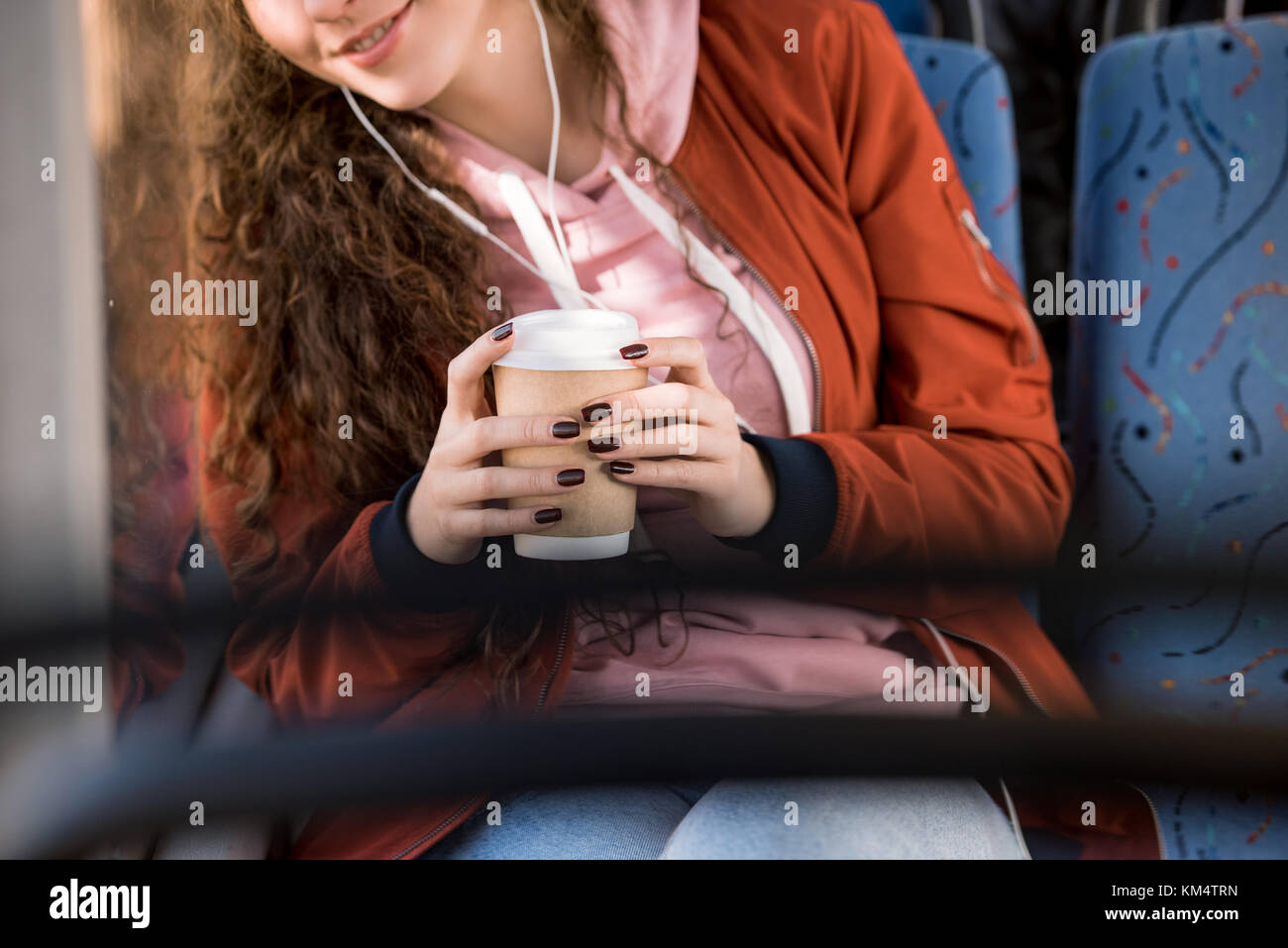 girl drinking coffee in bus Stock Photo - Alamy