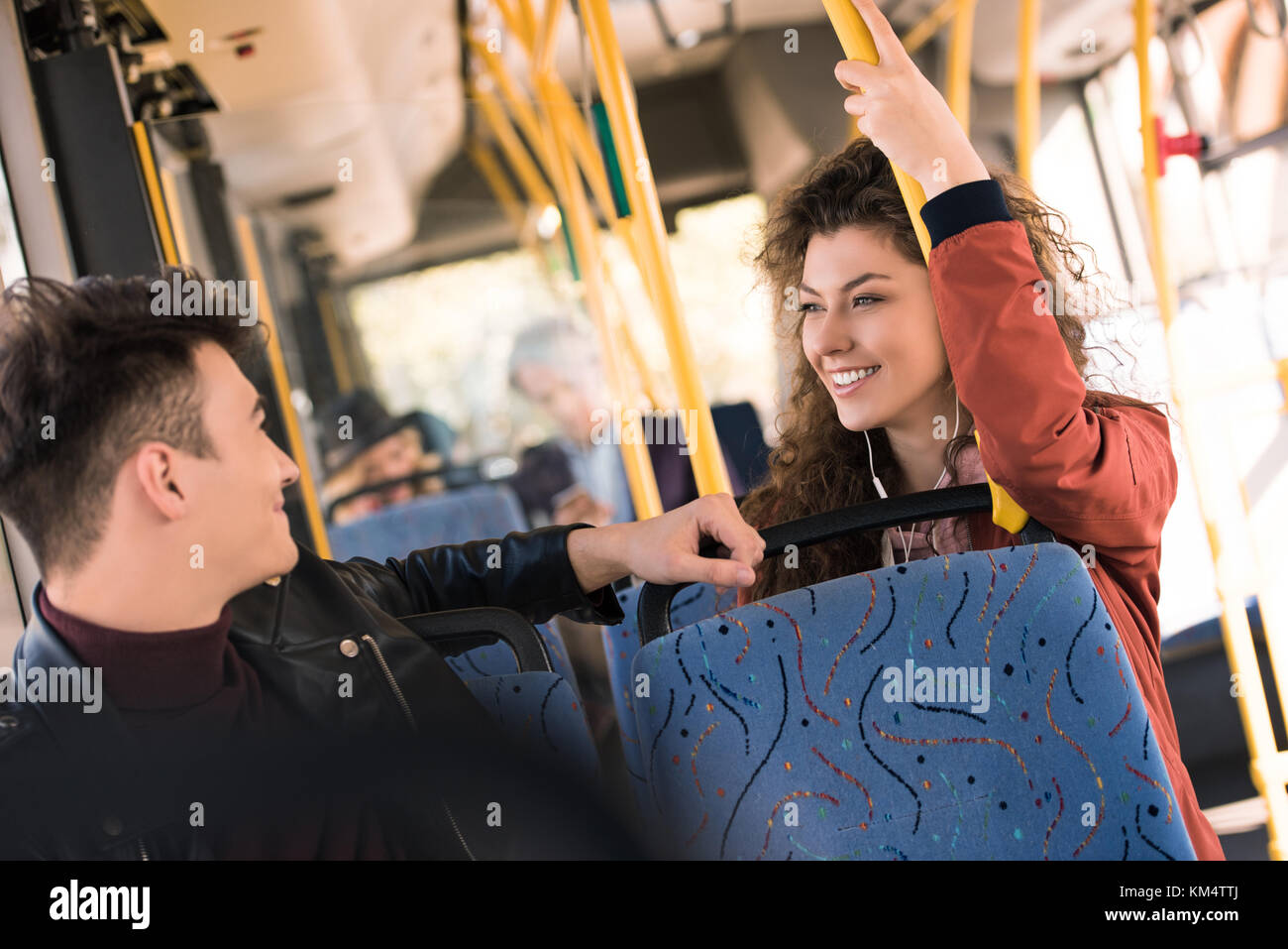 smiling couple in bus Stock Photo - Alamy