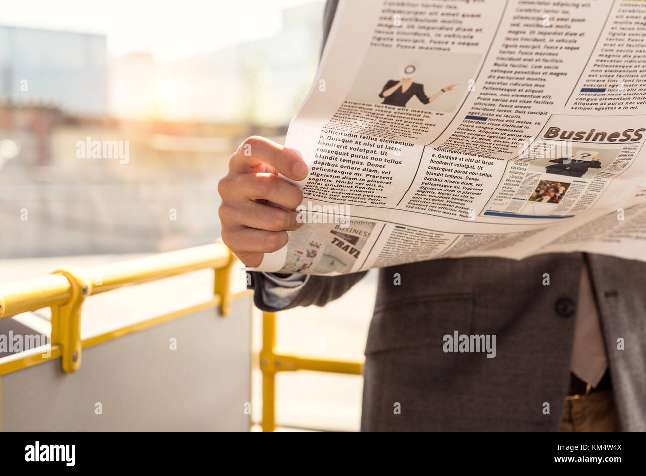 man with newspaper in bus Stock Photo - Alamy