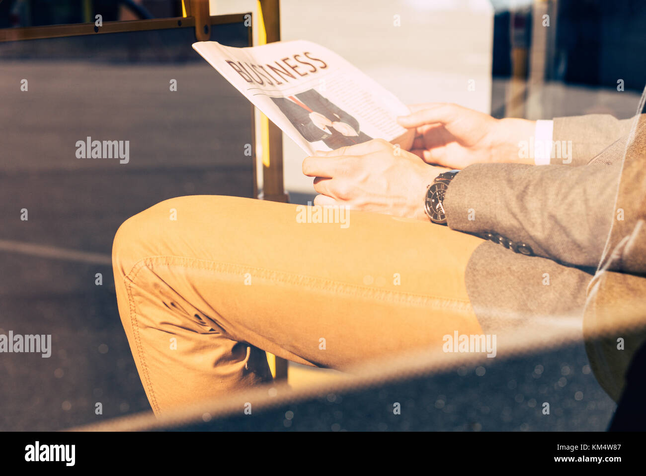 man with newspaper in bus Stock Photo - Alamy