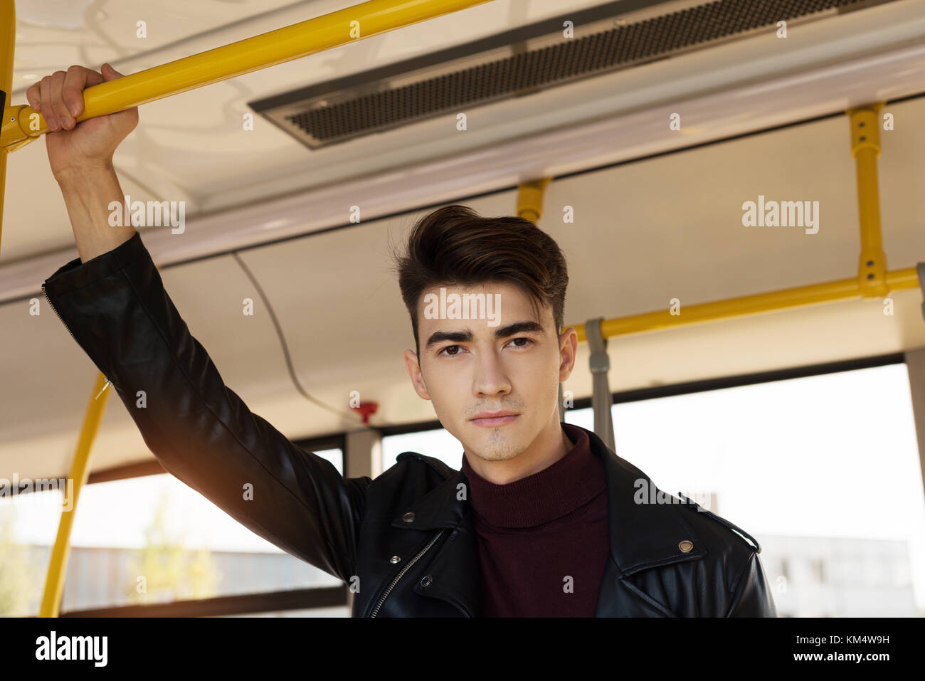 man riding in public transport Stock Photo - Alamy
