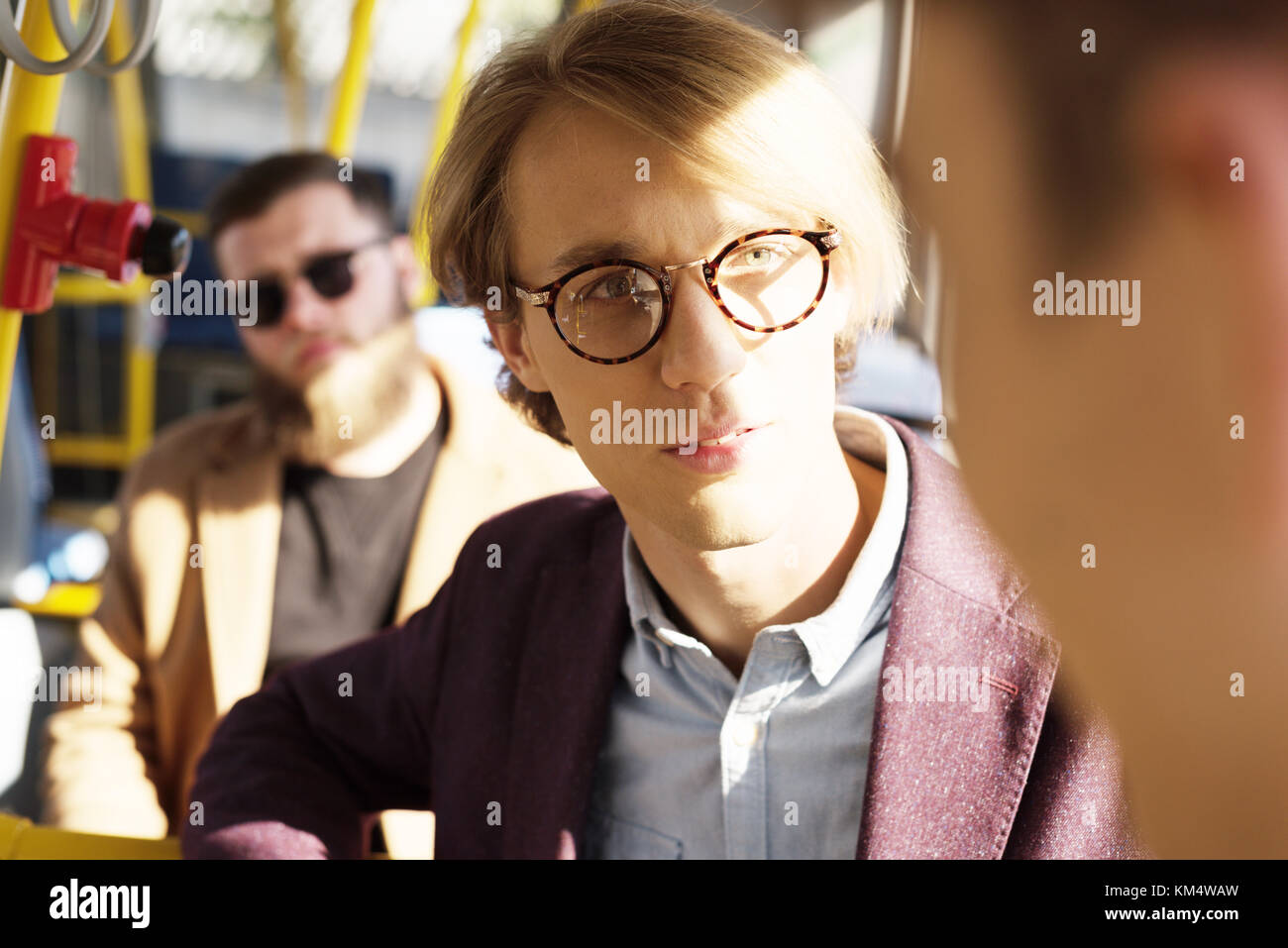 man in eyeglasses riding in city bus Stock Photo - Alamy