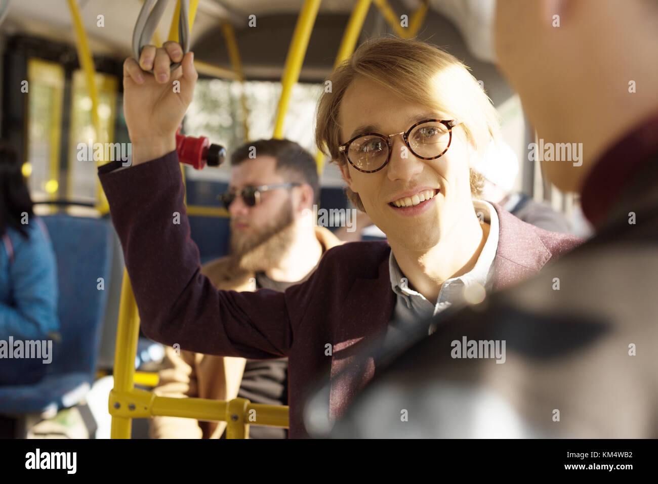 man in eyeglasses riding in city bus Stock Photo - Alamy