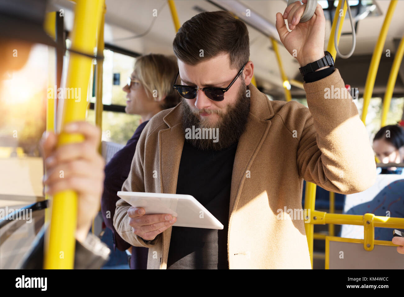 Man in bus with tablet hi-res stock photography and images - Alamy