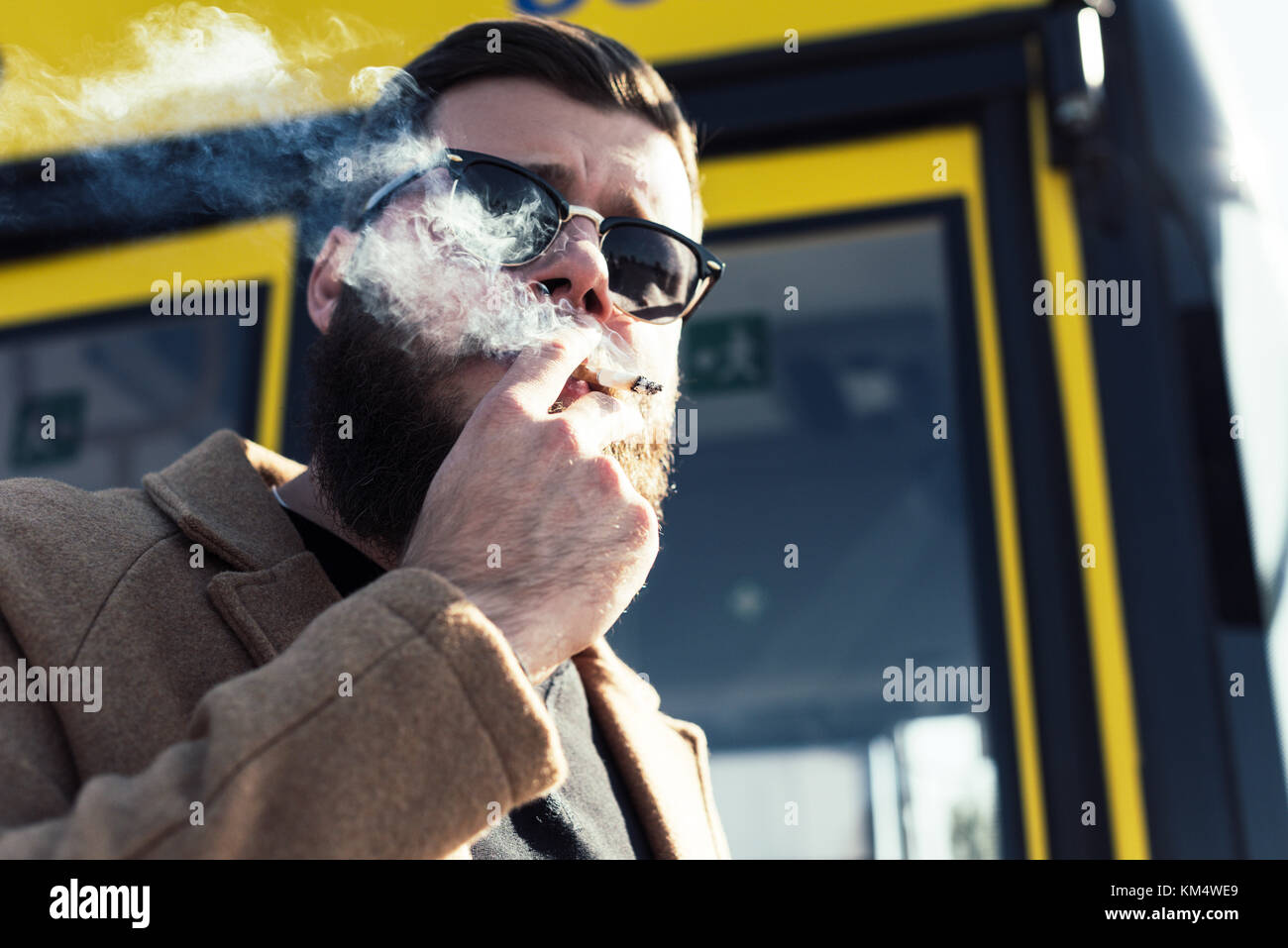 man smoking on street Stock Photo - Alamy