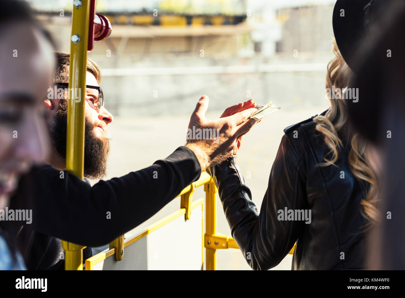 man passing ticket in bus Stock Photo - Alamy