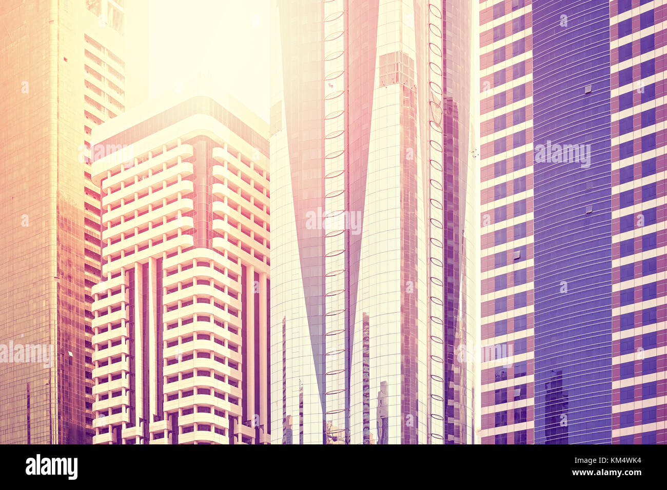 Color toned picture of modern buildings facades at sunset ...