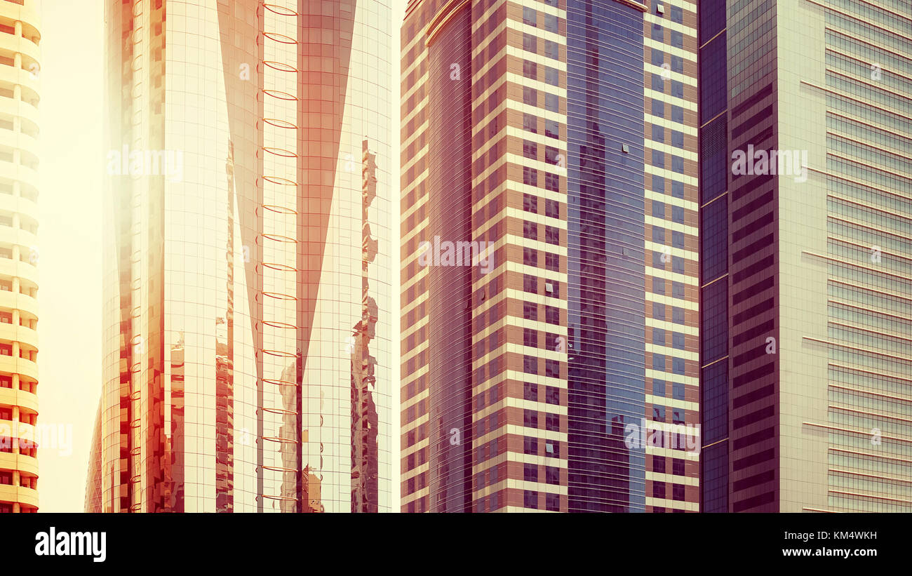 Color toned picture of modern buildings facades at sunset ...