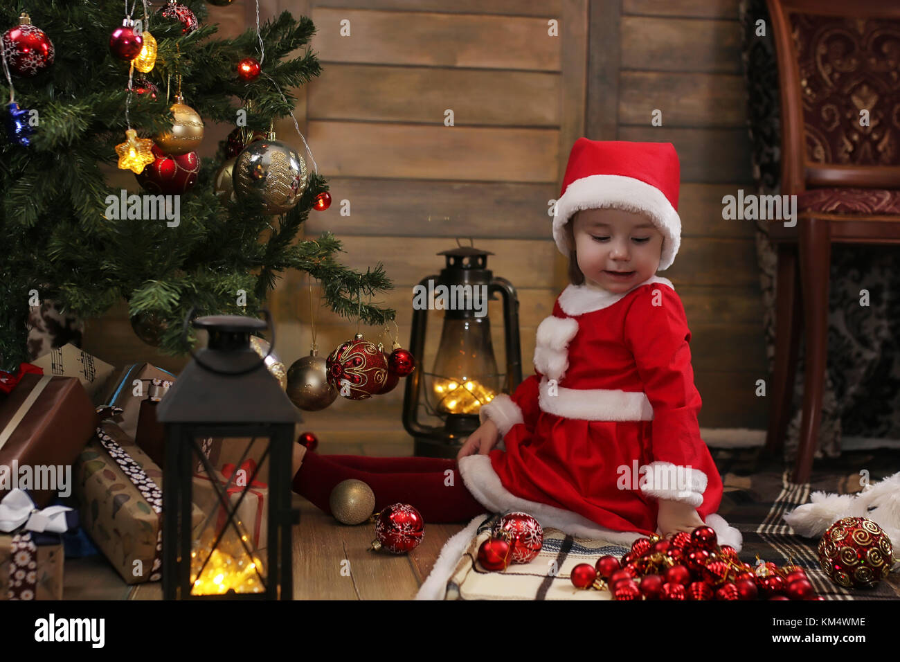 little child and Christmas toys Stock Photo - Alamy