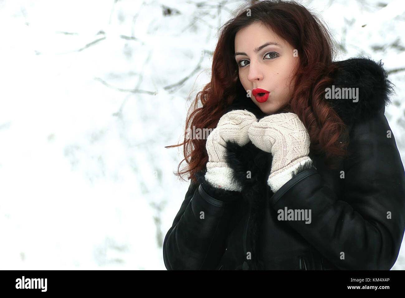 Beautiful girl in winter snowy day Stock Photo - Alamy