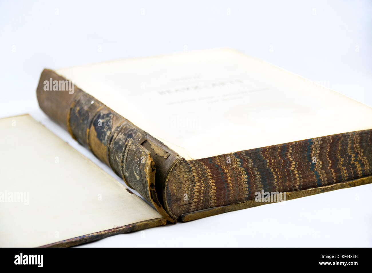 this torned book is an antique and needs to be repaired Stock Photo - Alamy