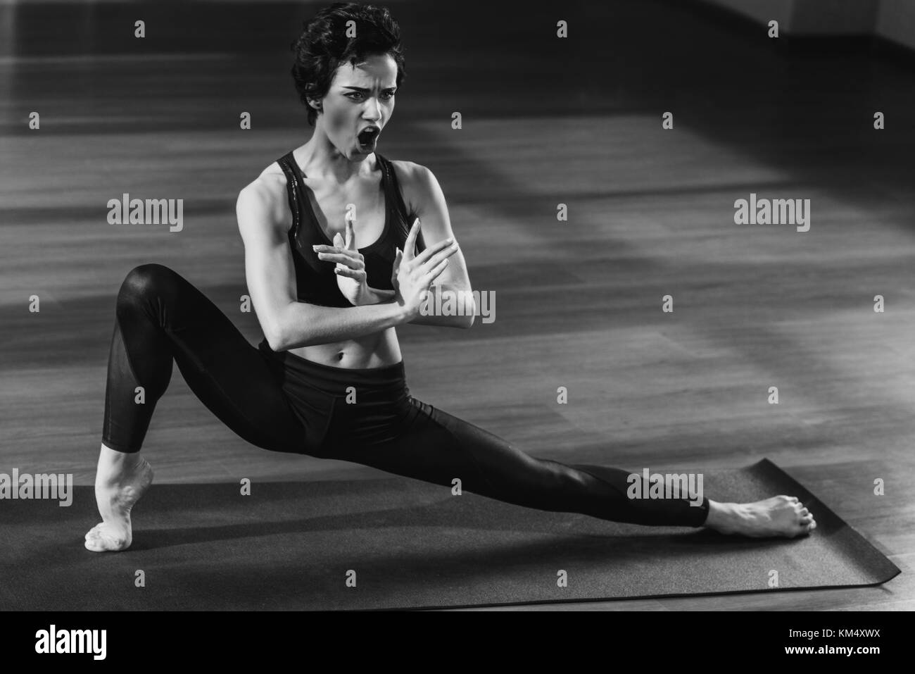 Yoga training woman on Black and White Stock Photos & Images - Alamy