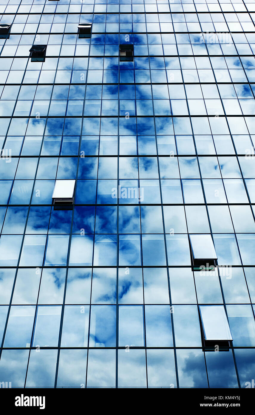 Blue glass wall of a skyscraper Stock Photo - Alamy