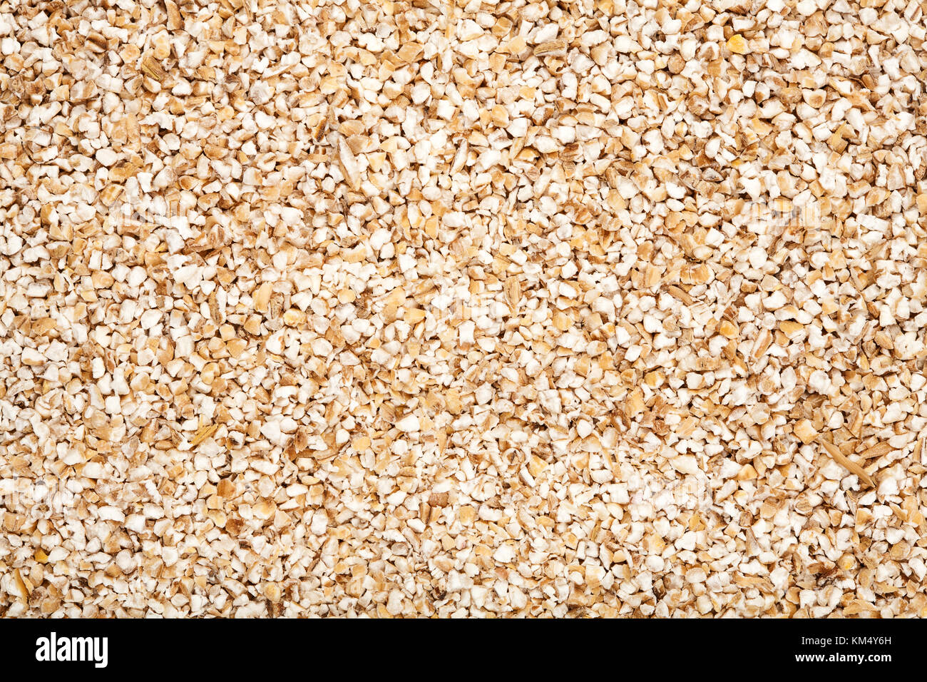 Roughly grind barley texture background Stock Photo - Alamy