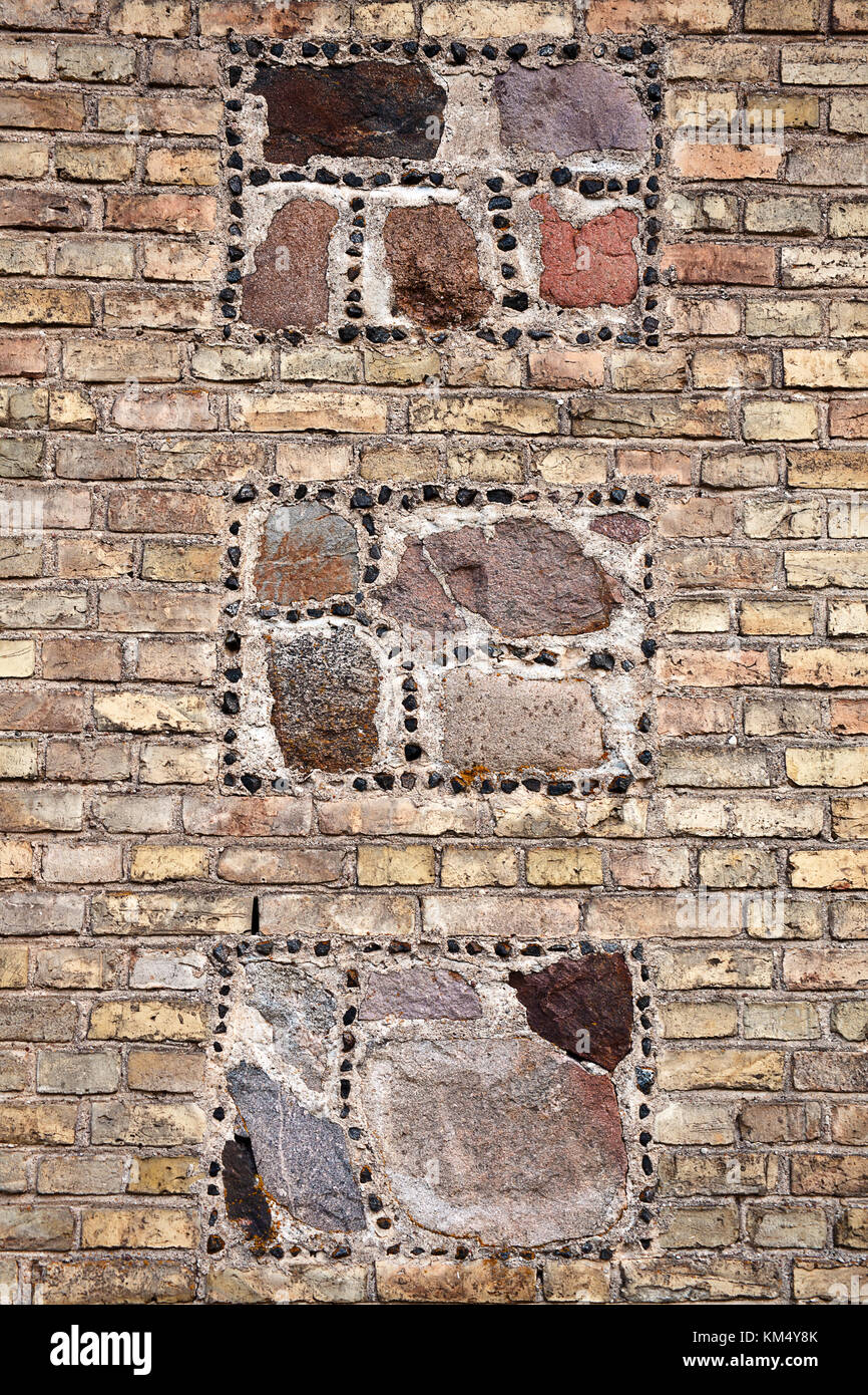 Wall of mixed materials - stone and bricks Stock Photo - Alamy