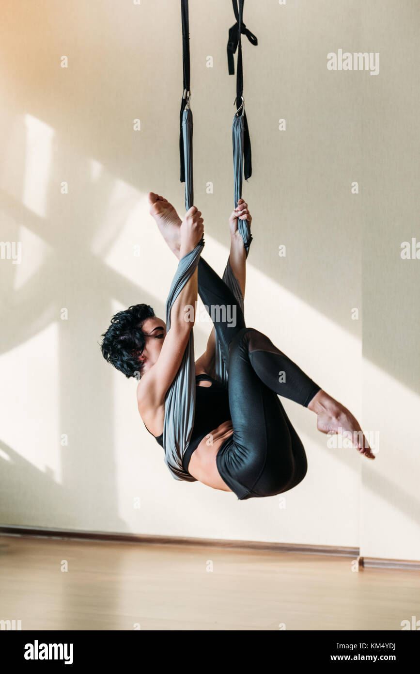 woman practicing fly yoga Stock Photo - Alamy