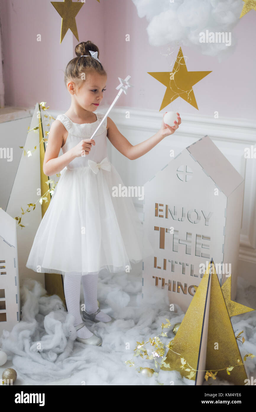 Little happy fairy or angel with magic wand on Holiday theme. Portrait ...