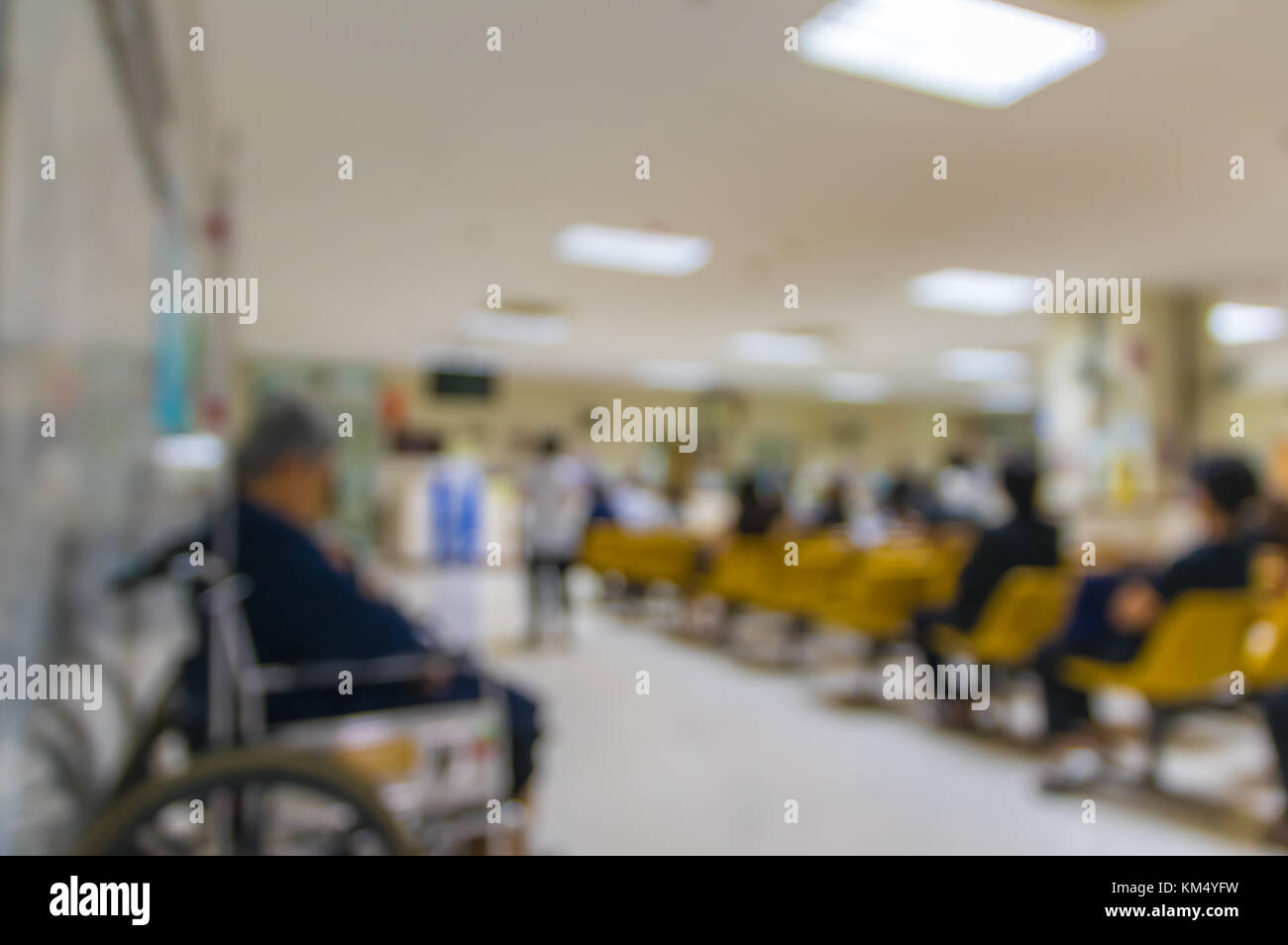 Abstract photo blurred of hospital background with patient sitting ...
