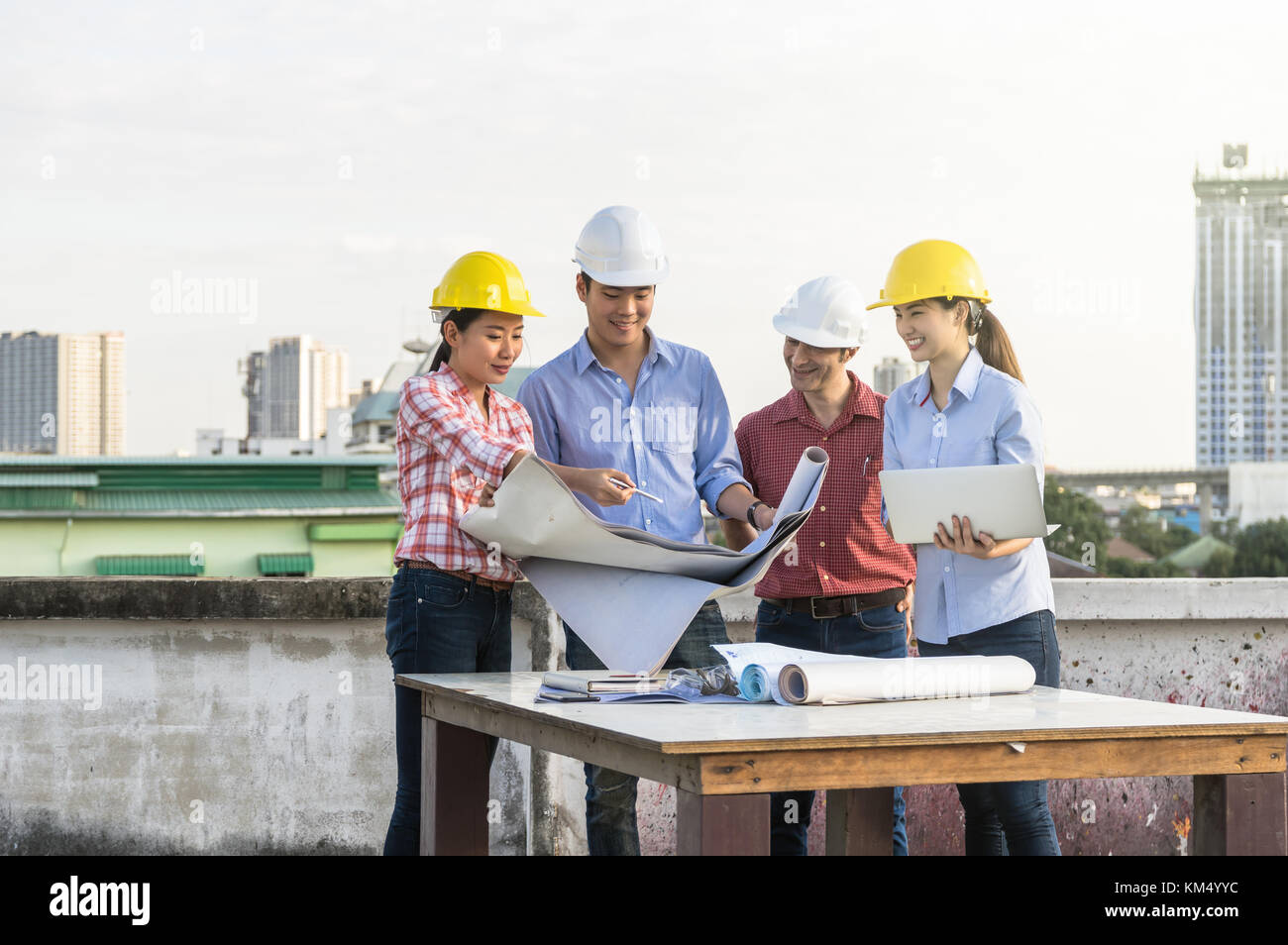 Happy professional construction engineers working with Corporate ...