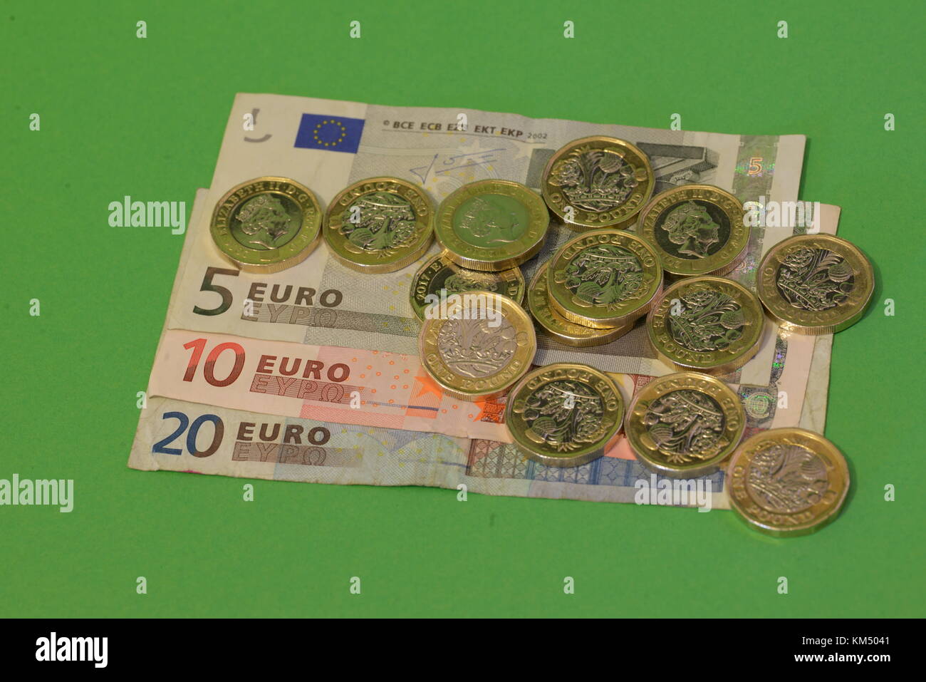 Euro currency notes and UK currency notes and coins Stock Photo - Alamy