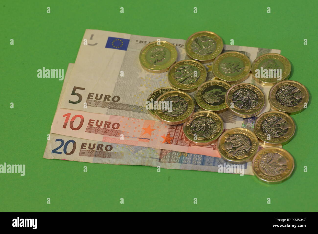 Euro currency notes and UK currency notes and coins Stock Photo - Alamy