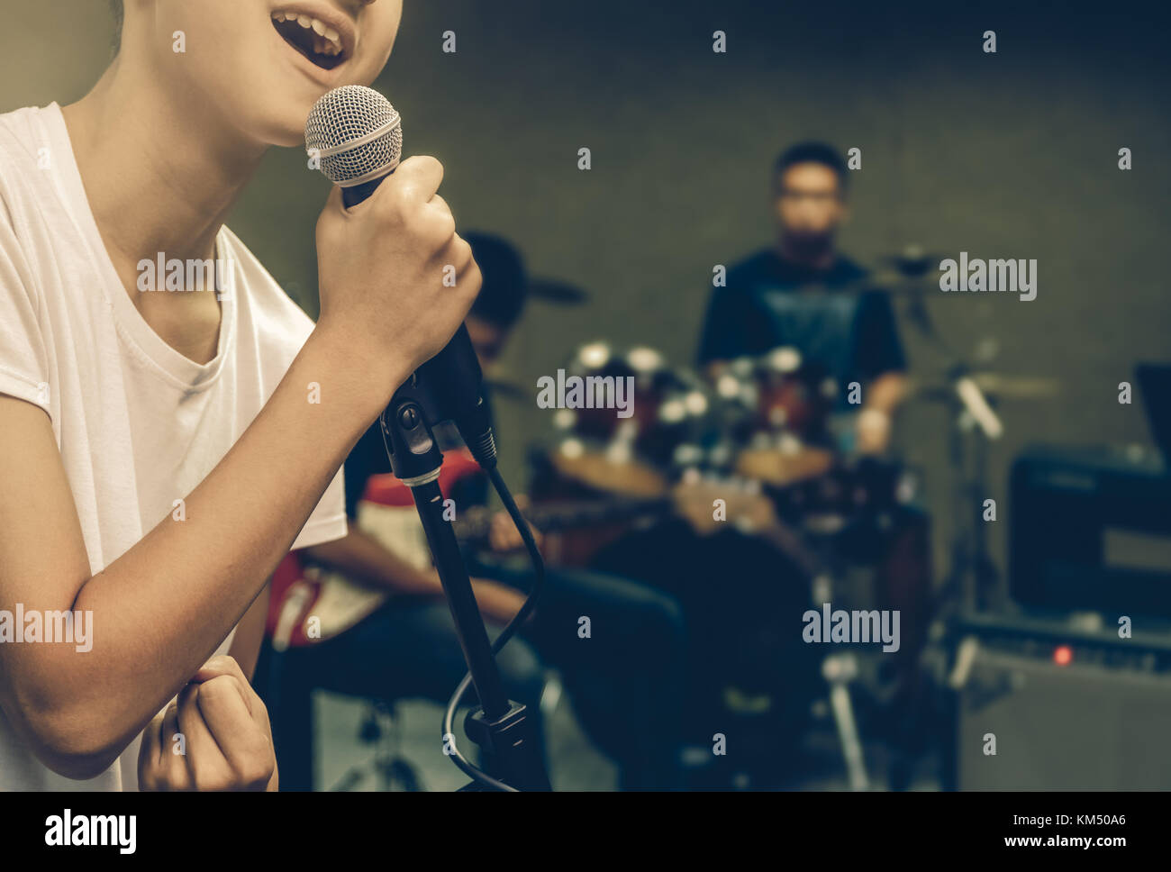 Woman holding microphone closeup hand hi-res stock photography and ...