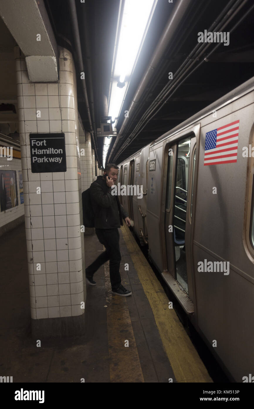 F train pulling into the station platform at the Fort Hamilton Parkway ...