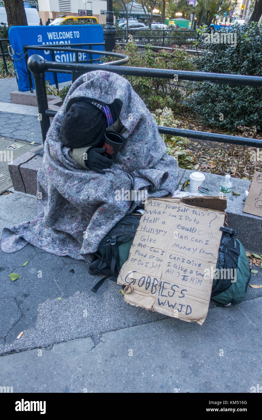 Homeless worn out man with sign begs for money and food at Union Square ...