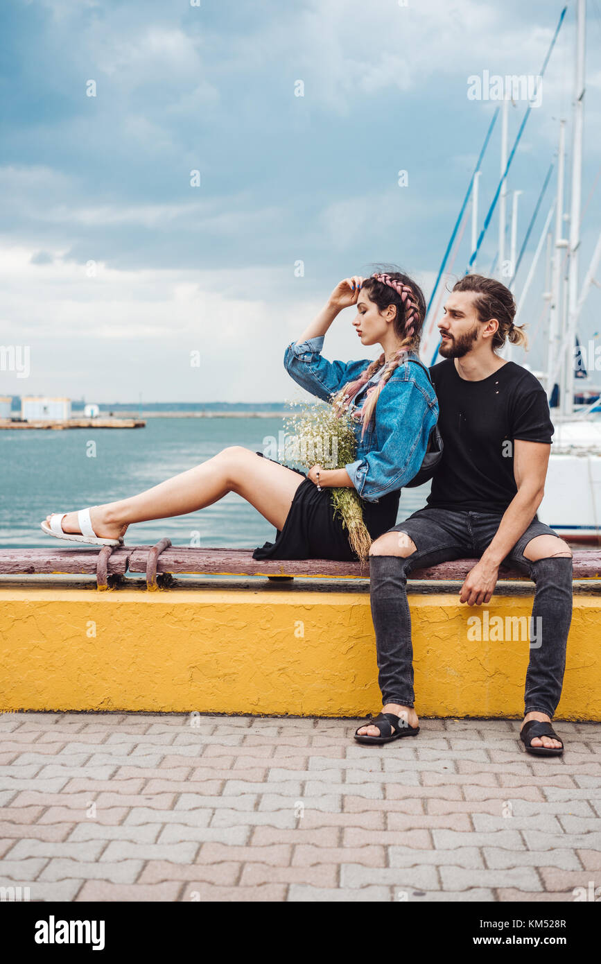 Guy and girl on pier Stock Photo - Alamy