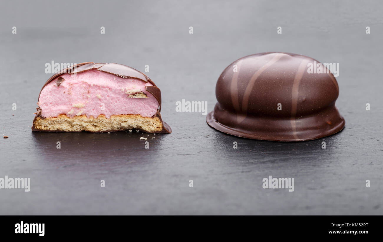 round chocolate candy on a black slate board Stock Photo - Alamy