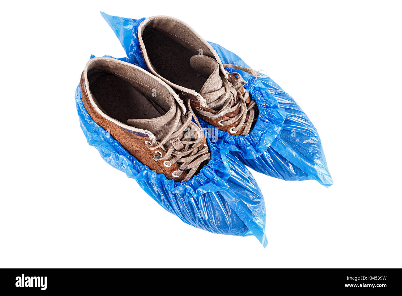 blue protective shoe covers on men's shoes isolated on white background ...