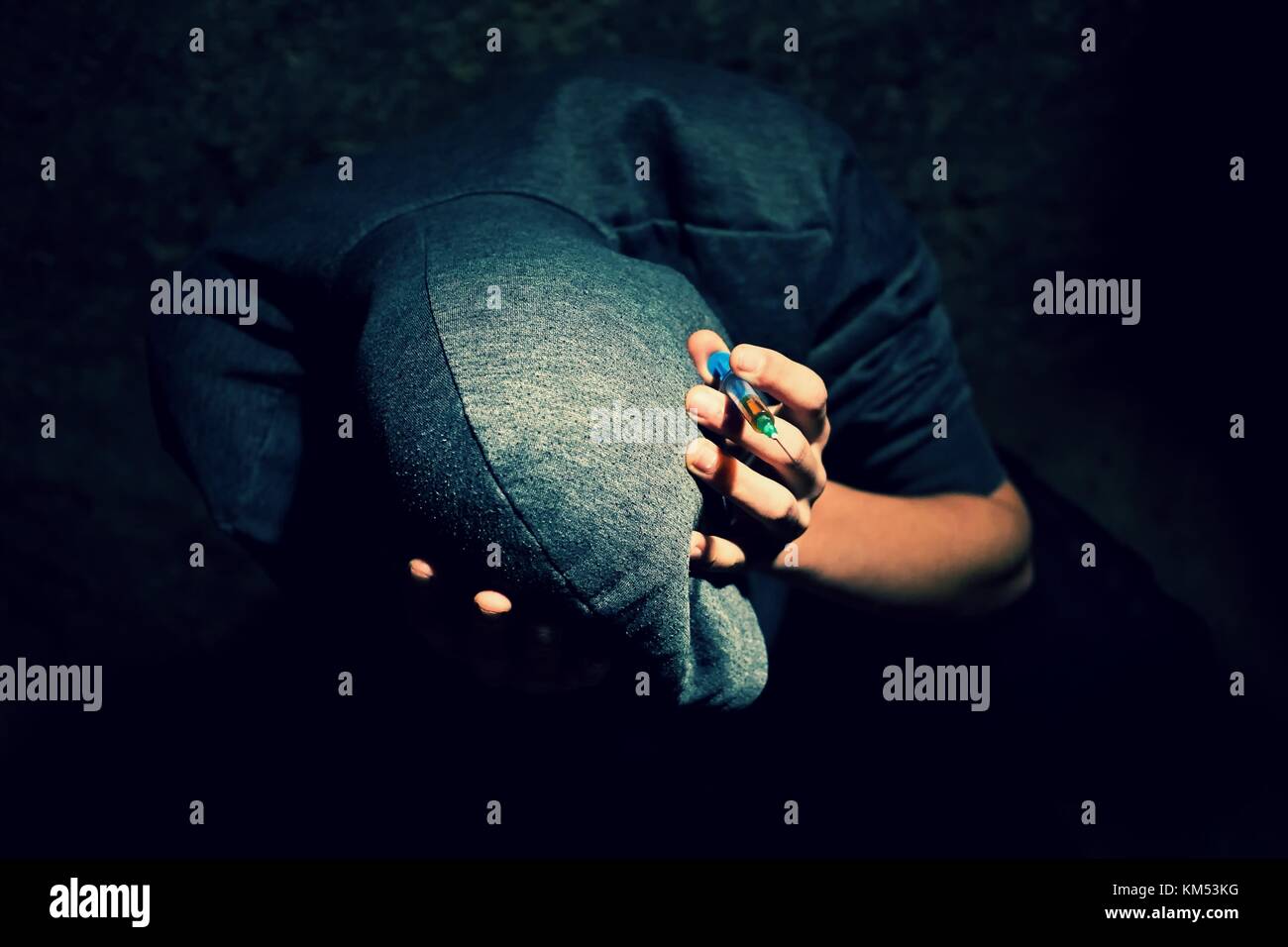 Drugs concept. Disease concept. Drug addict man with syringe using ...