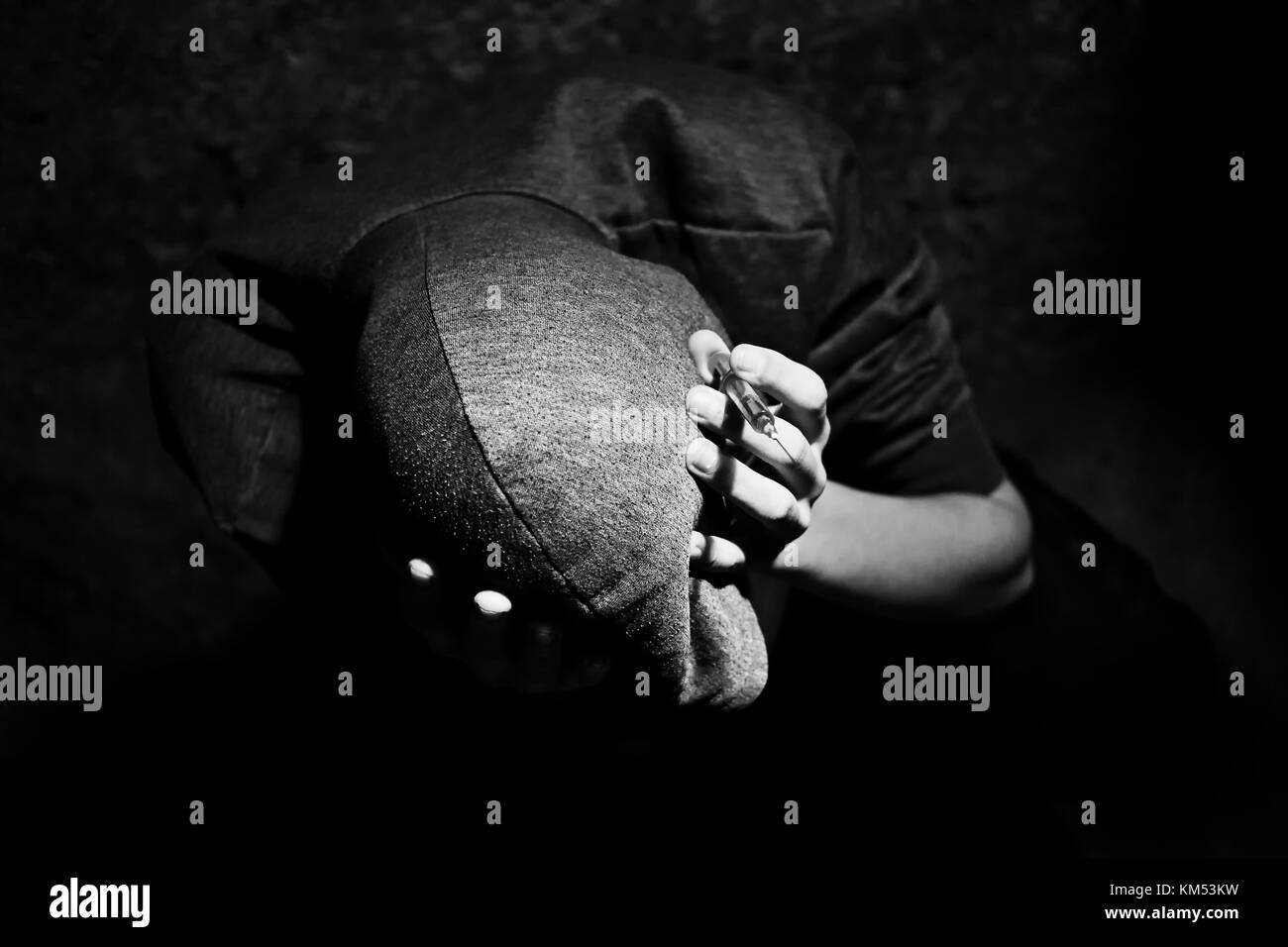 Drugs concept. Disease concept. Drug addict man with syringe using ...