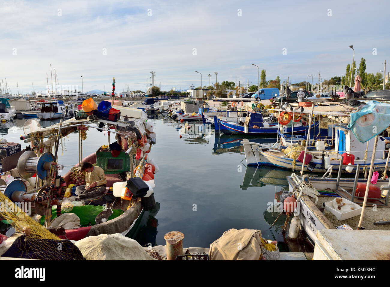 Greek harbour with traditional fishing boats moored, Gulf of Aegina, in ...
