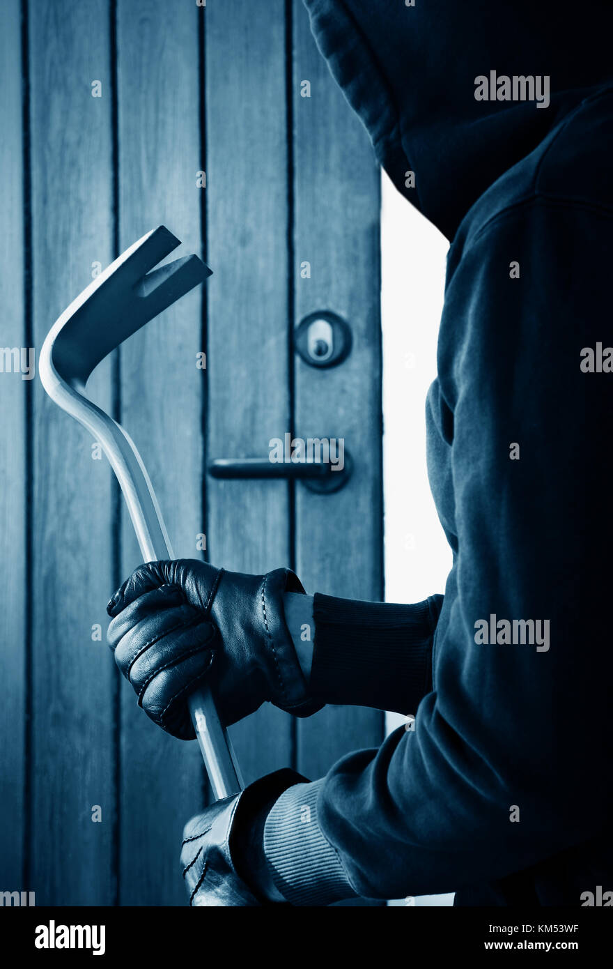 Burglar hand holding crowbar Stock Photo - Alamy