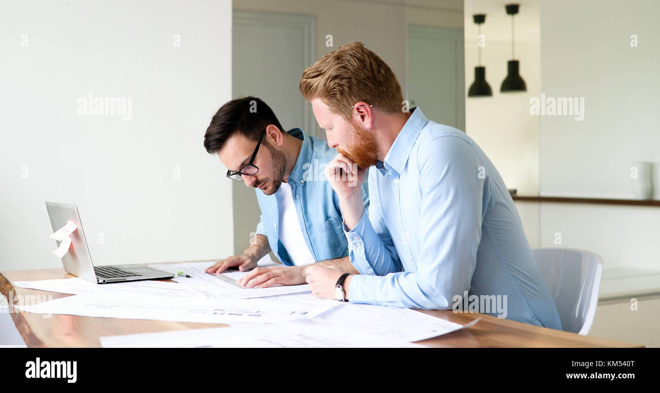 Group of architects working on project Stock Photo - Alamy