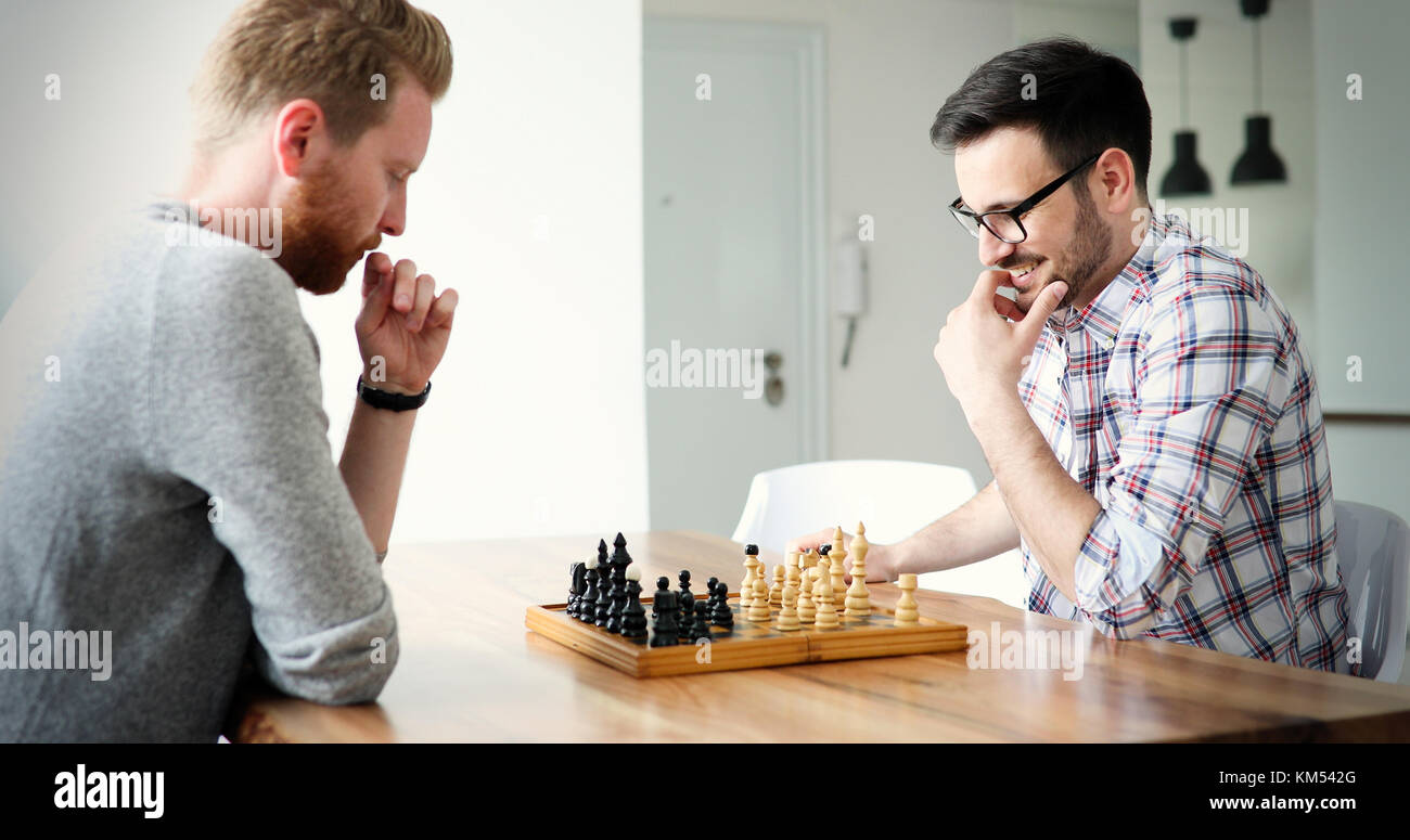 Two young man playing chess Stock Photo - Alamy