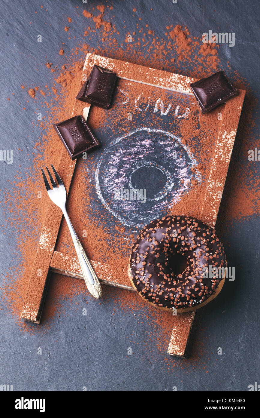 Top view on chocolate and drawing donuts with dark chocolate and ...