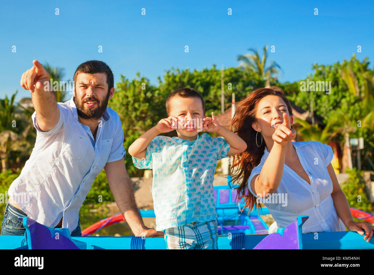 Happy full family. Young father, mother, baby son have fun together on ...