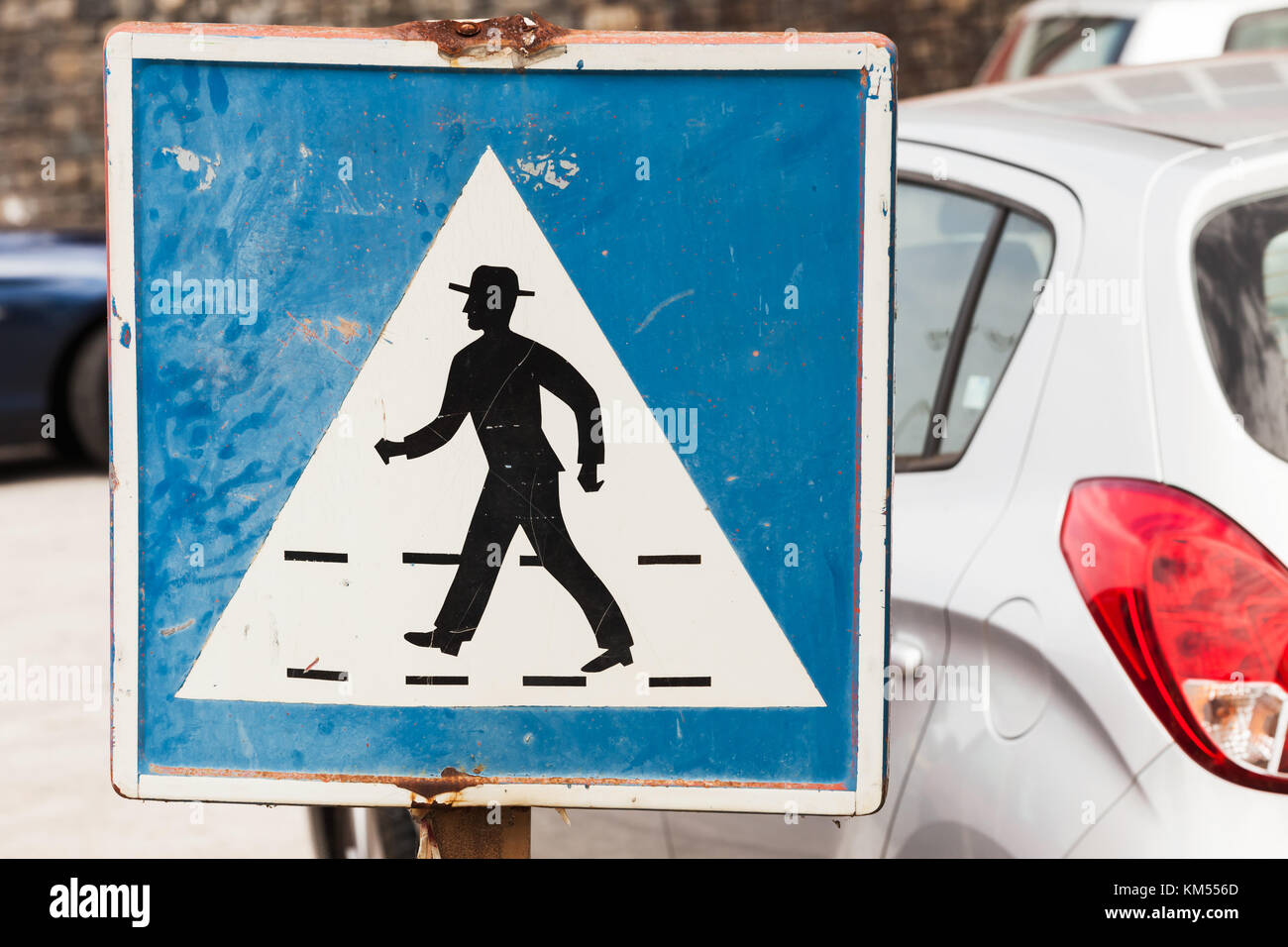 Pedestrian crossing. Old square blue and white road sign with schematic ...