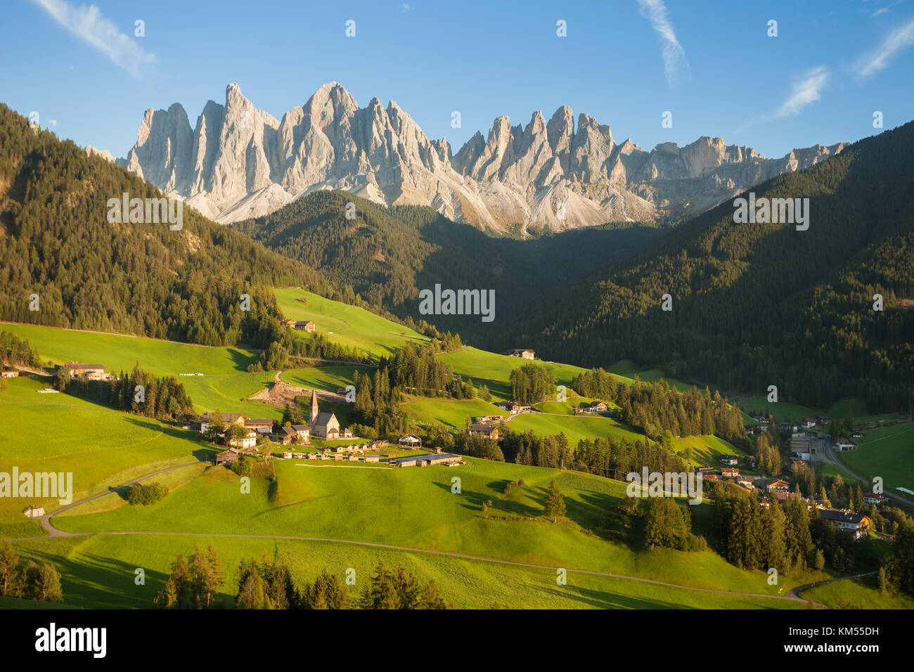 Small Italian mountain town of St. Magdalena in Val di Funes at sunset ...