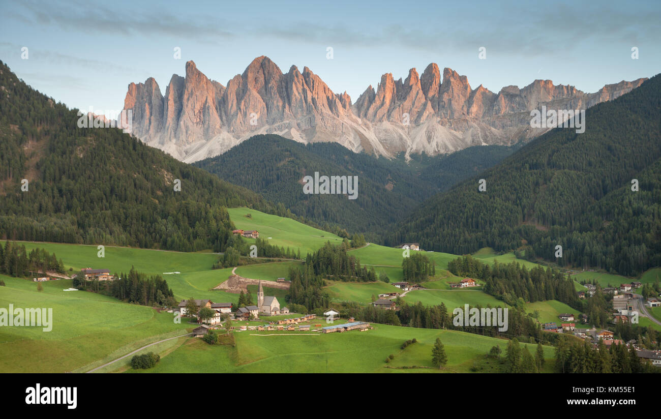 Small Italian mountain town of St. Magdalena in Val di Funes at sunset ...