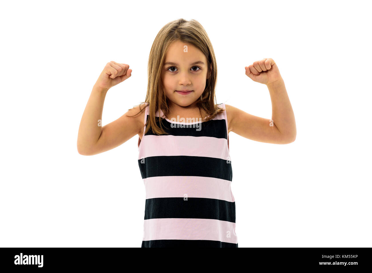 Portrait of happy young little girl showing and flexing muscles ...