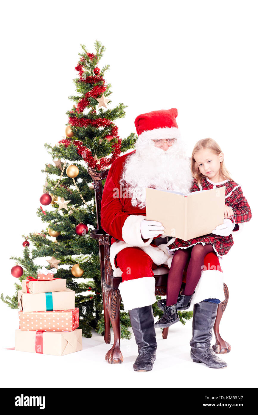 Santa reading story for cute girl Stock Photo - Alamy