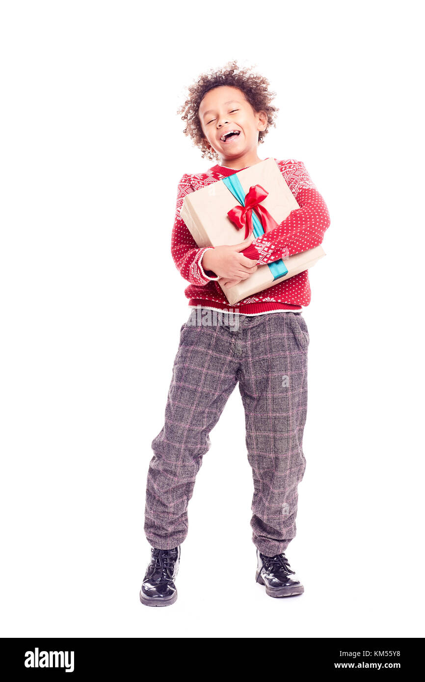 Cheerful boy holding gift Cut Out Stock Images & Pictures - Alamy