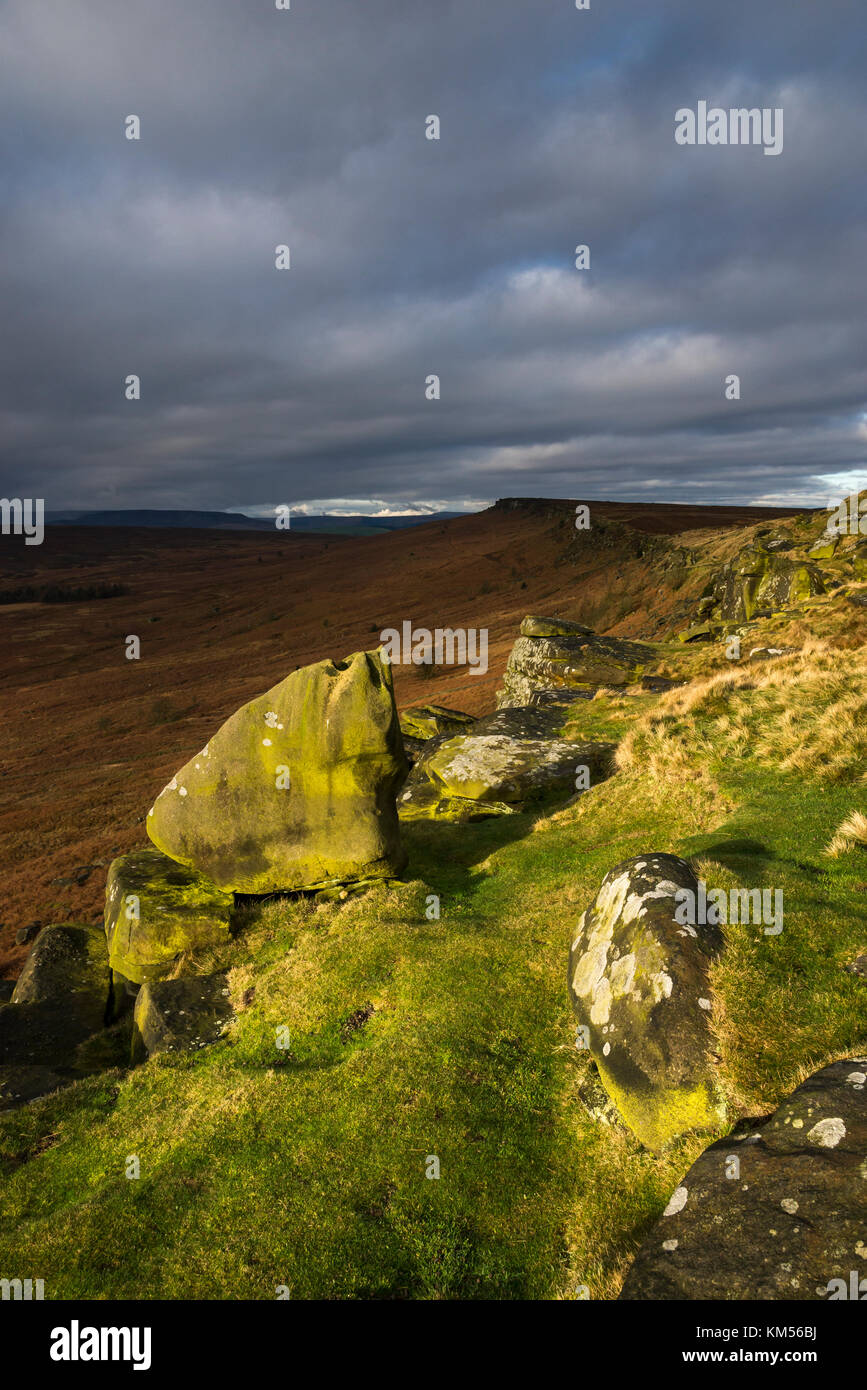Winter sunlight on rocks at Stanage edge in the Peak District national ...