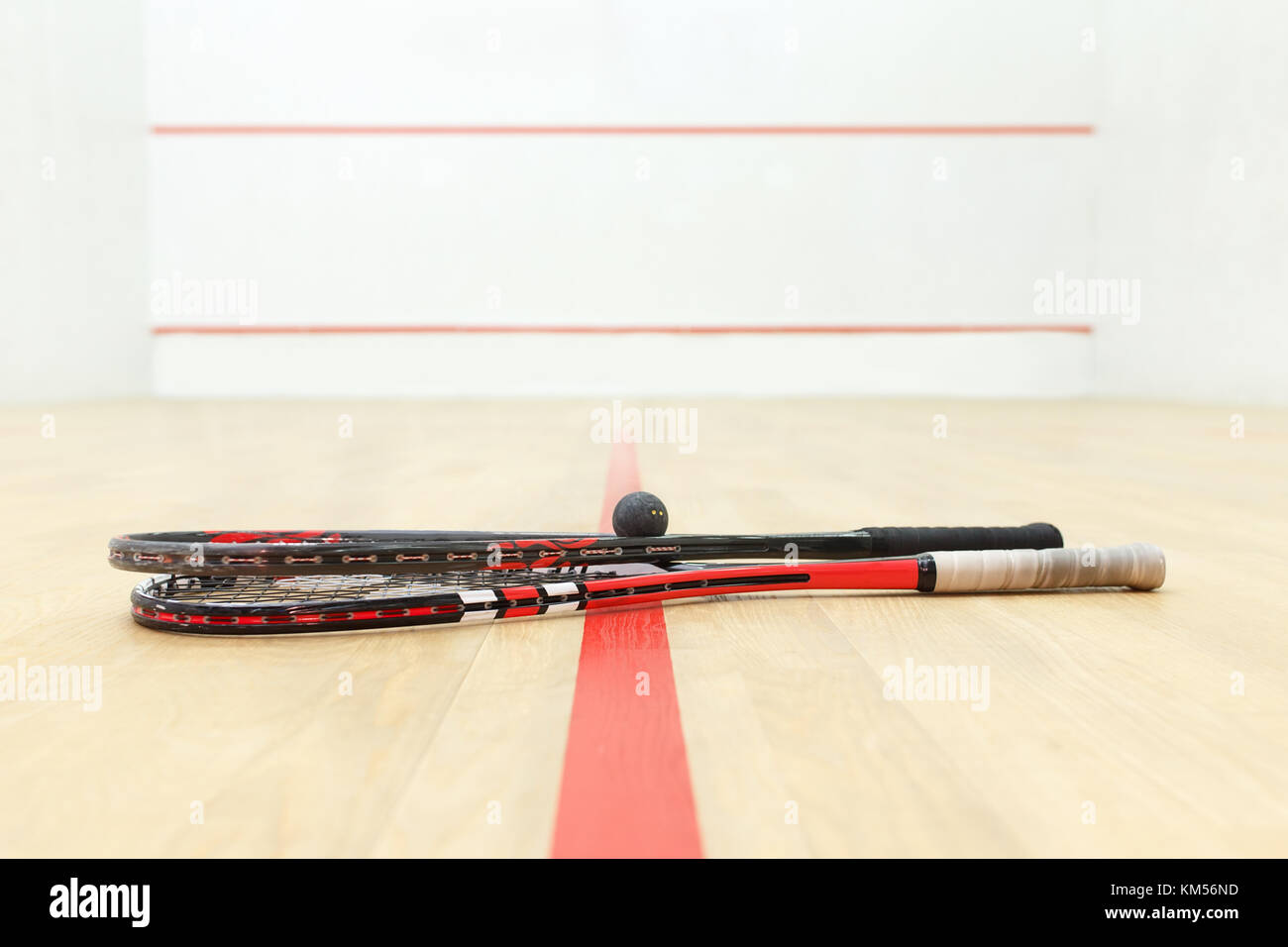 racquetball equipment and wall with red lines Stock Photo - Alamy