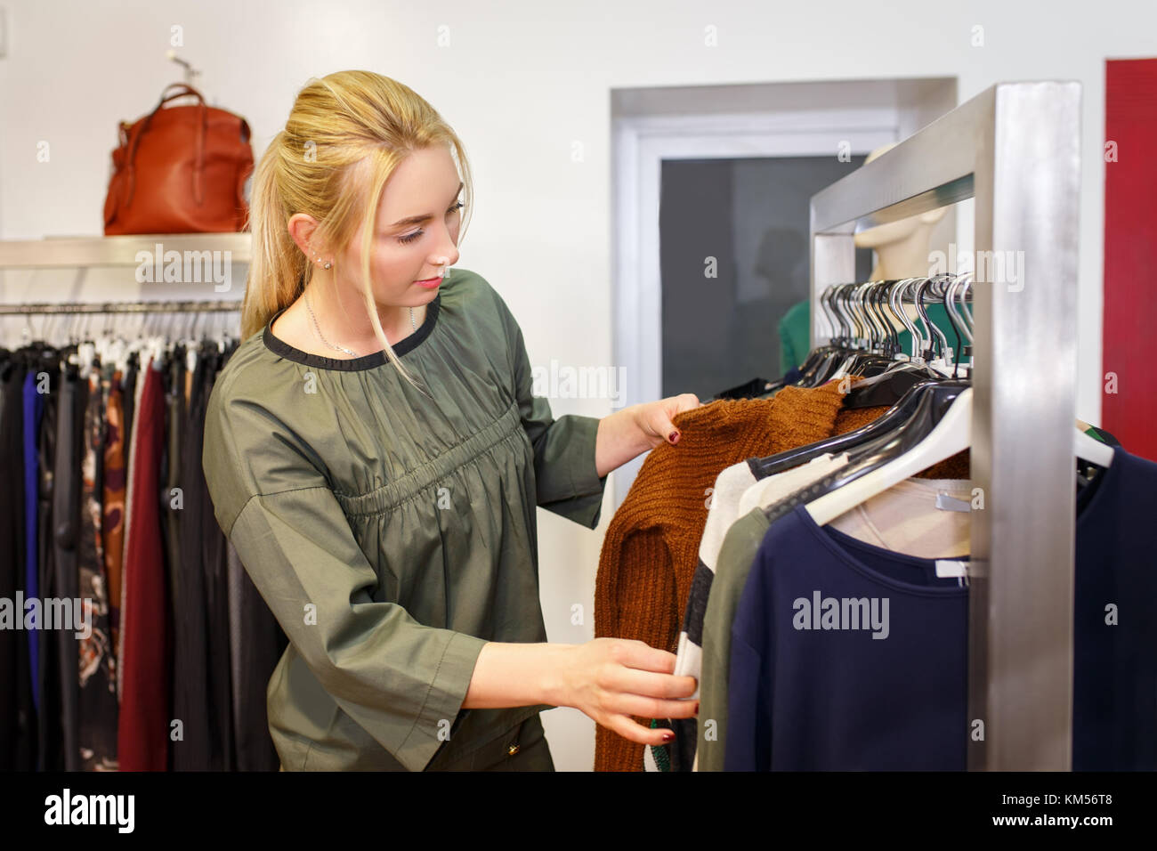 young woman chooses in the store Stock Photo - Alamy